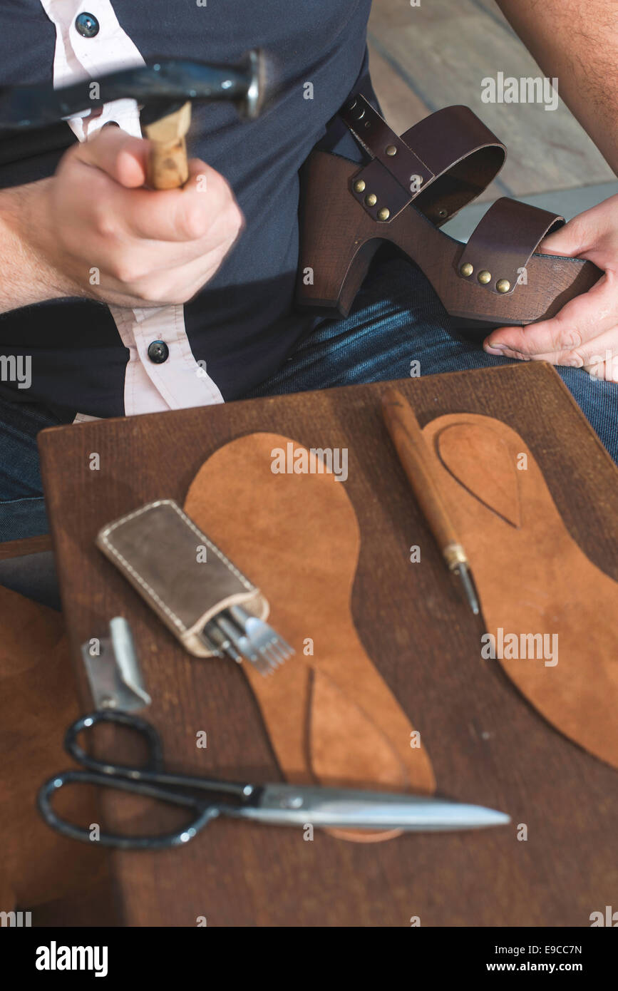 Hands making shoes. Shoemaker Stock Photo - Alamy