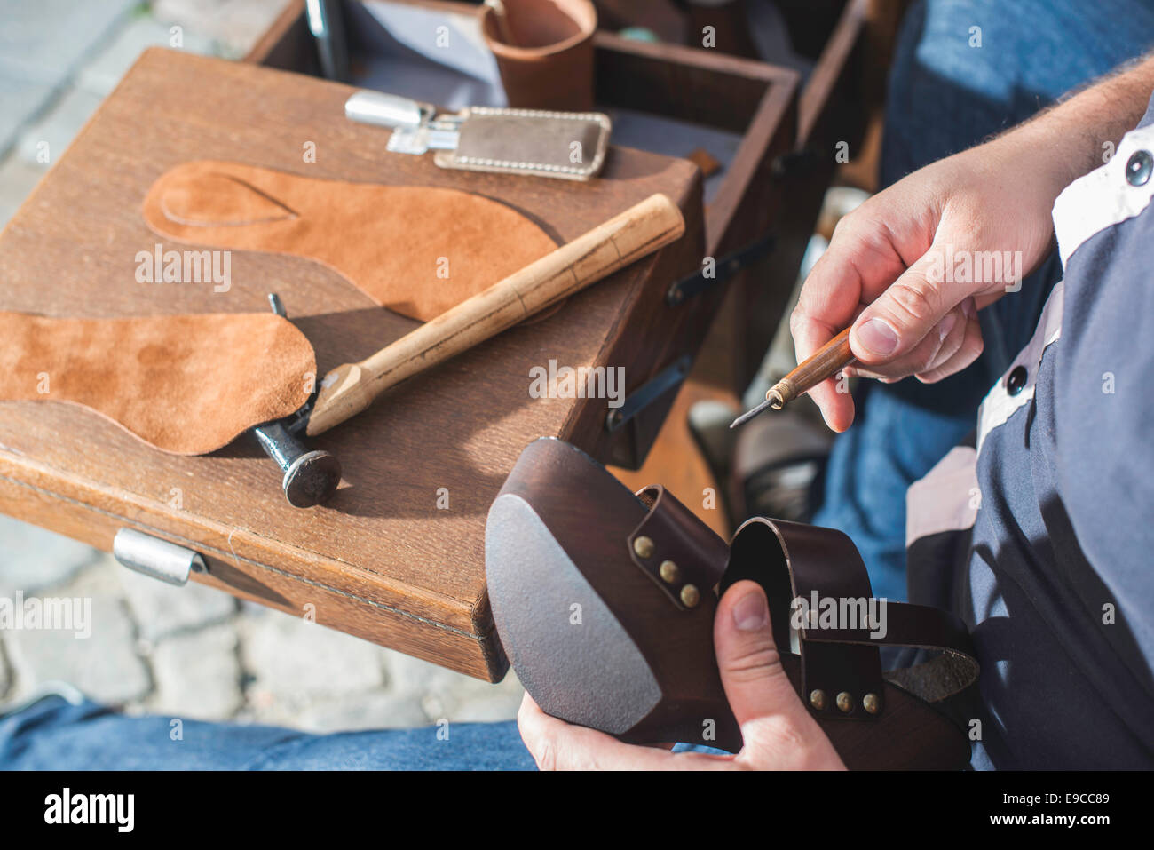 Hands making shoes. Shoemaker Stock Photo - Alamy