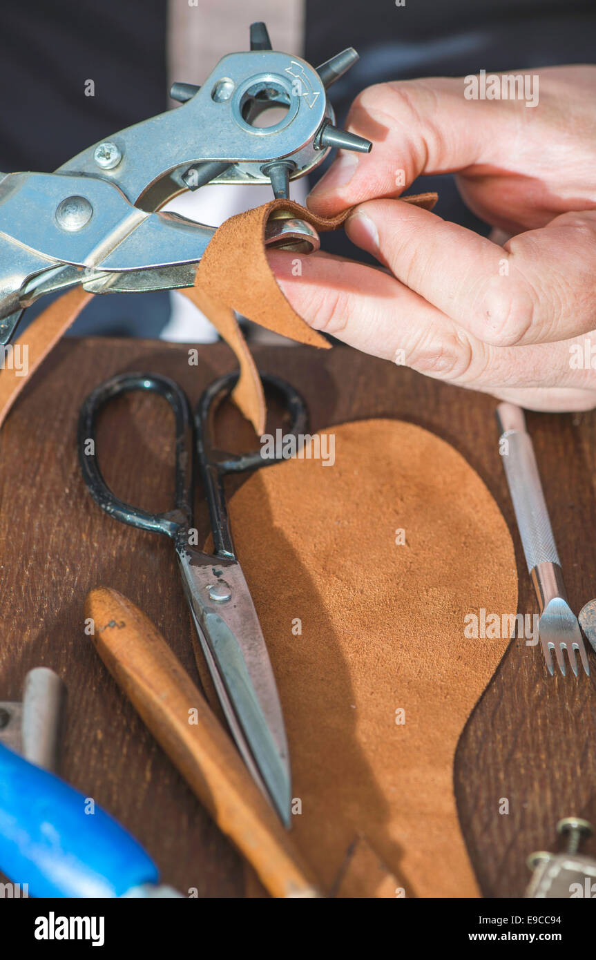 Man making handmade sandals hi-res stock photography and images - Alamy