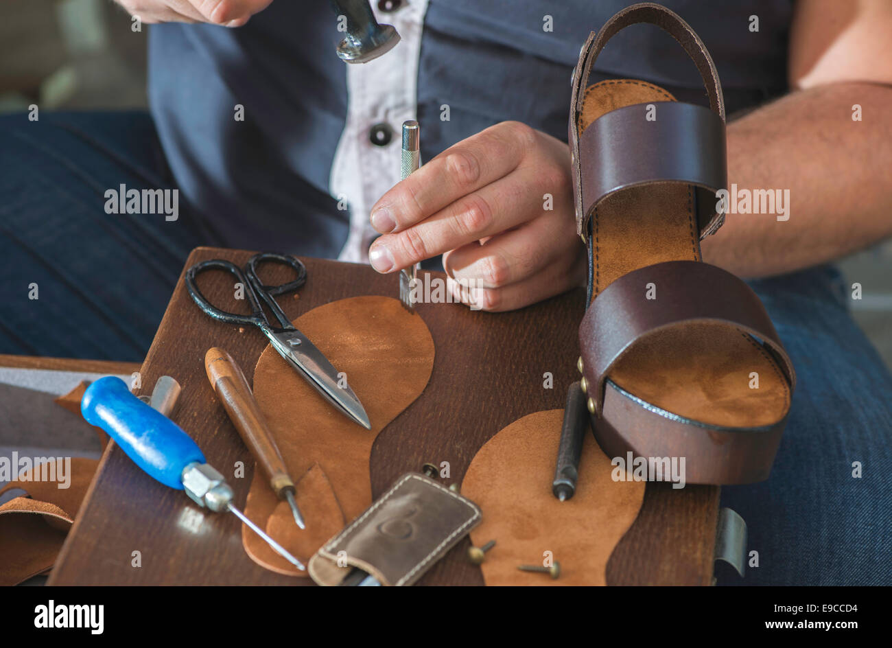 Making shoes manual. Leather sandals Stock Photo - Alamy