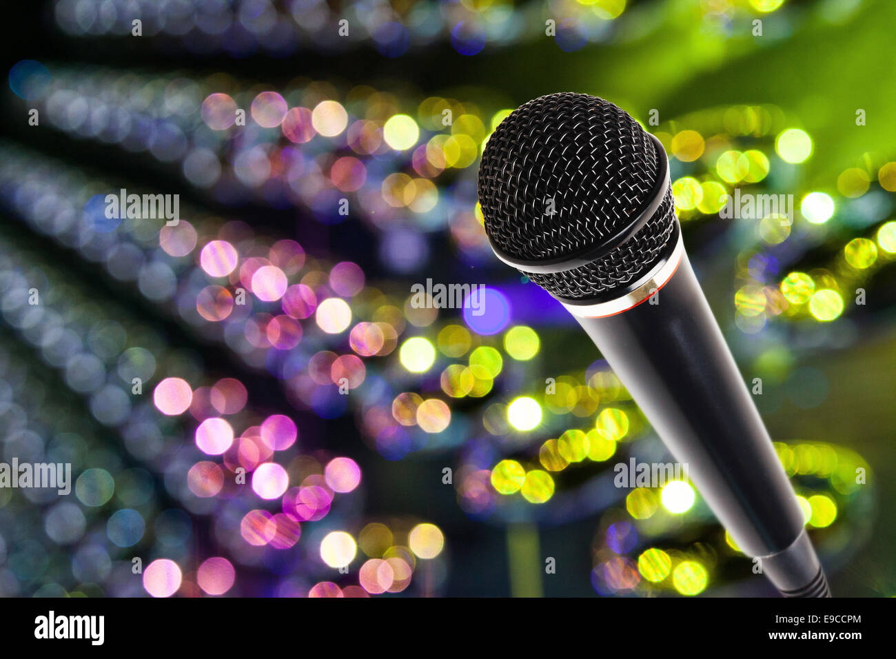 Stylish microphone isolated on blurred background Stock Photo - Alamy