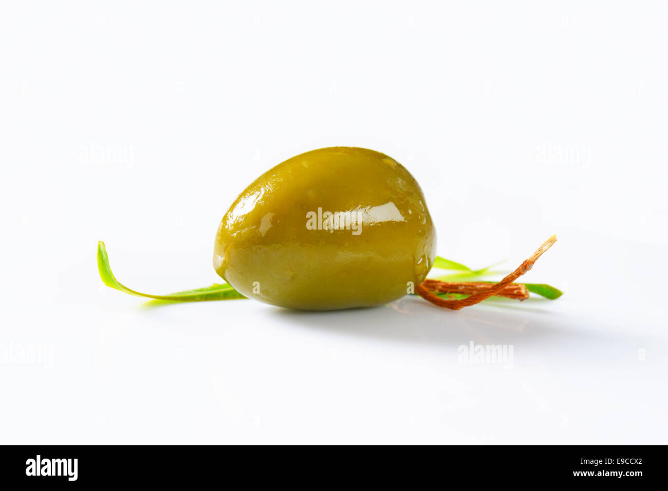 Unpitted green olive - studio shot Stock Photo - Alamy