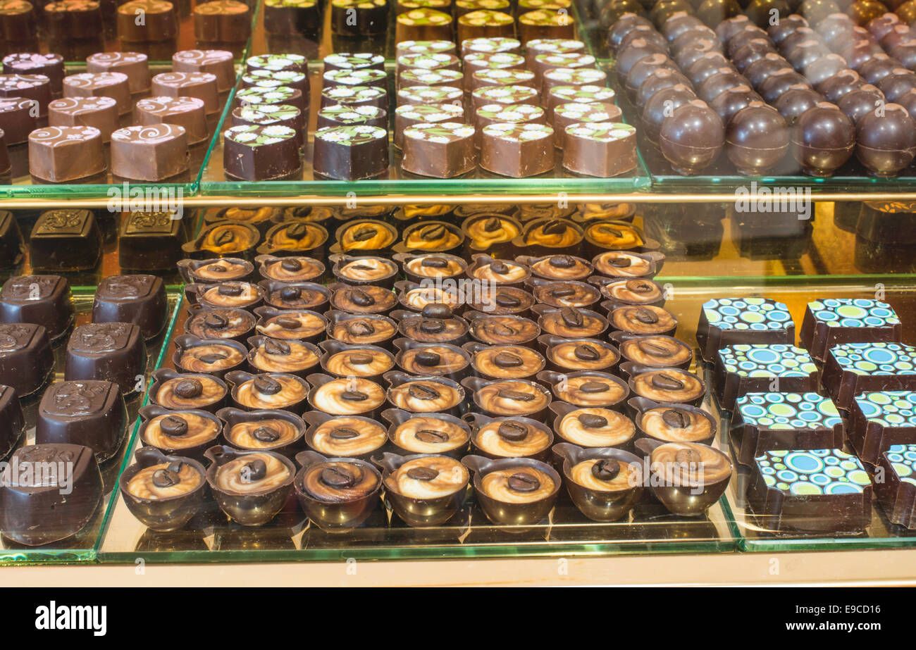 Chocolate candy in a store window. Stand with chocolates Stock Photo ...