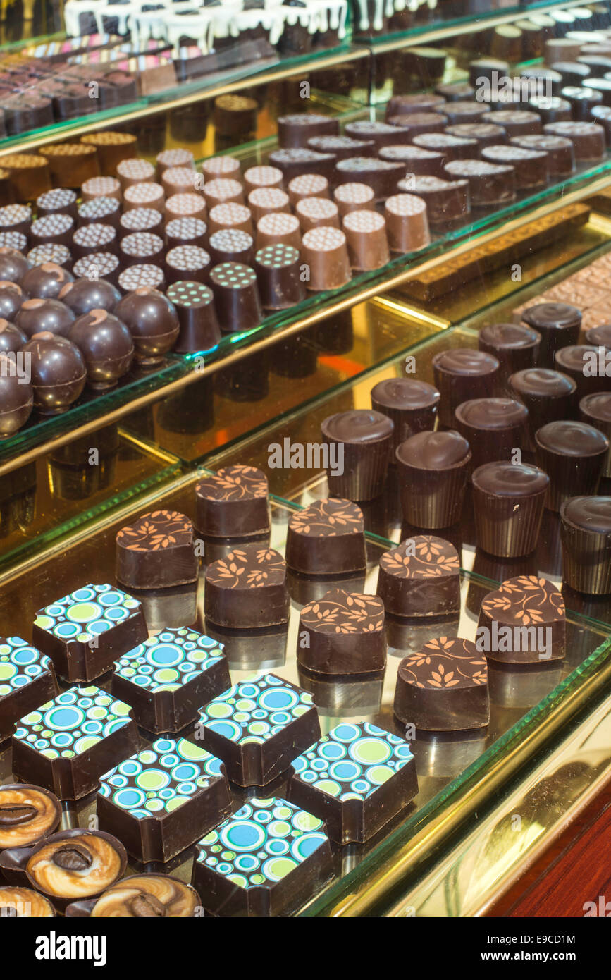 Chocolate candy in a store window. Stand with chocolates Stock Photo ...