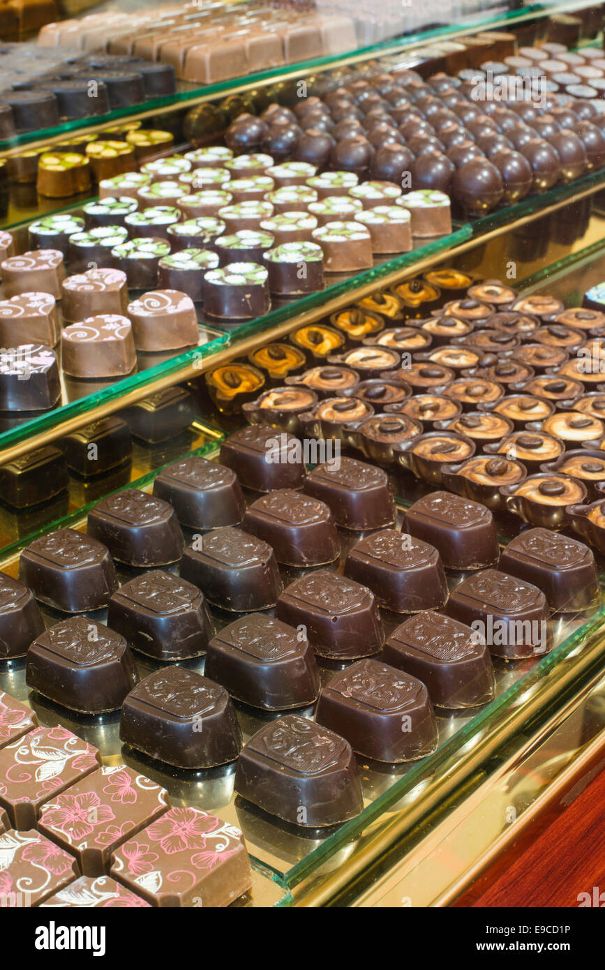 Chocolate candy in a store window. Stand with chocolates Stock Photo ...