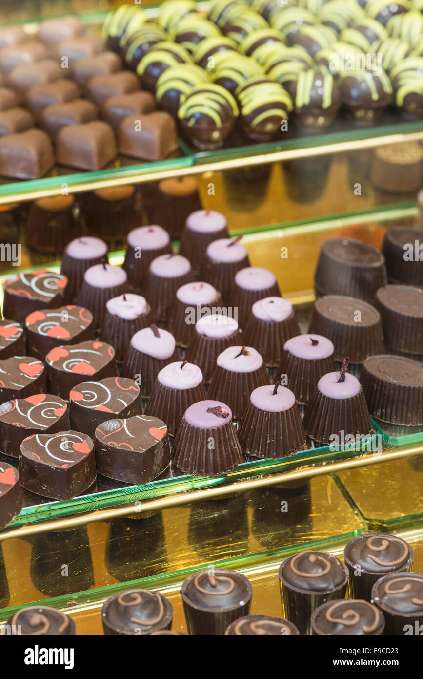 Chocolate candy in a store window. Stand with chocolates Stock Photo ...