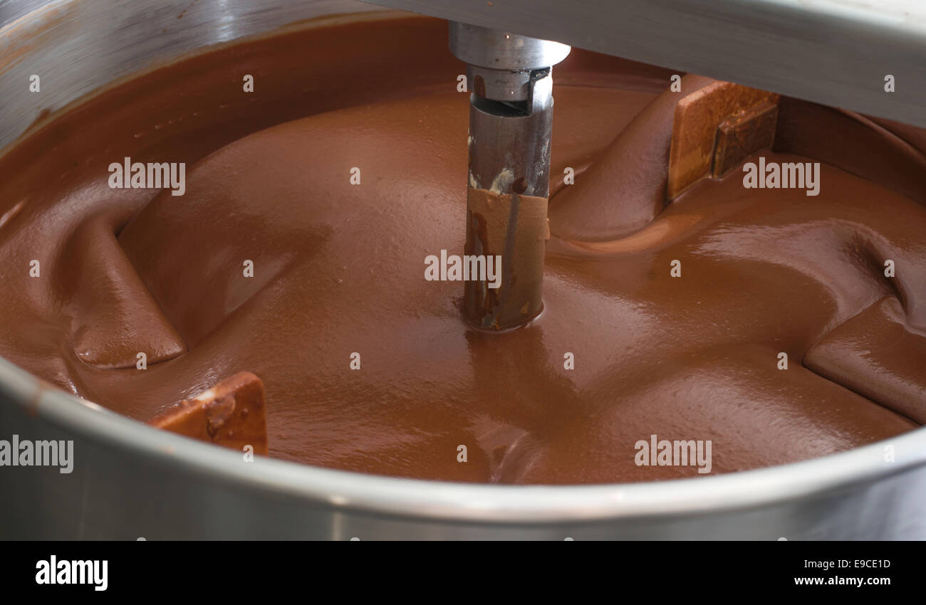 Machine for mixing chocolate. Close up Stock Photo - Alamy