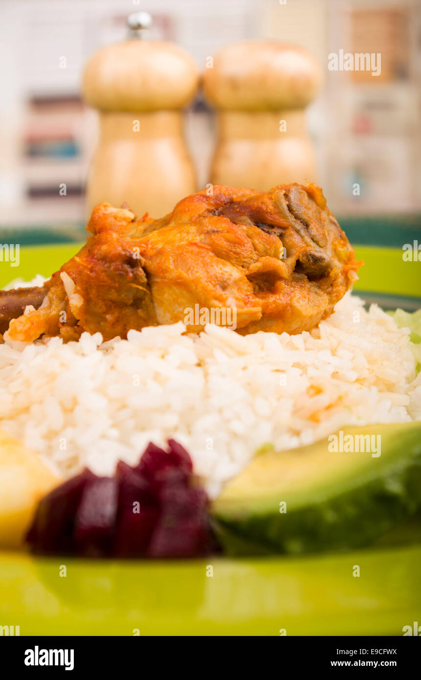 chicken served with white rice potato on a plate Stock Photo - Alamy