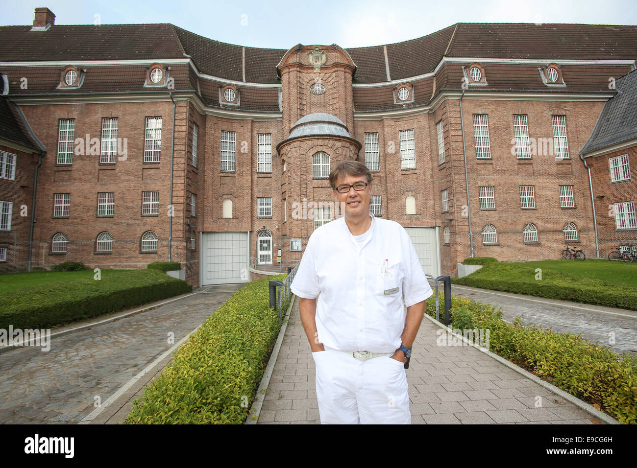 Kiel, Germany. 22nd Oct, 2014. Prison doctor Thomas Jedamski stands at ...