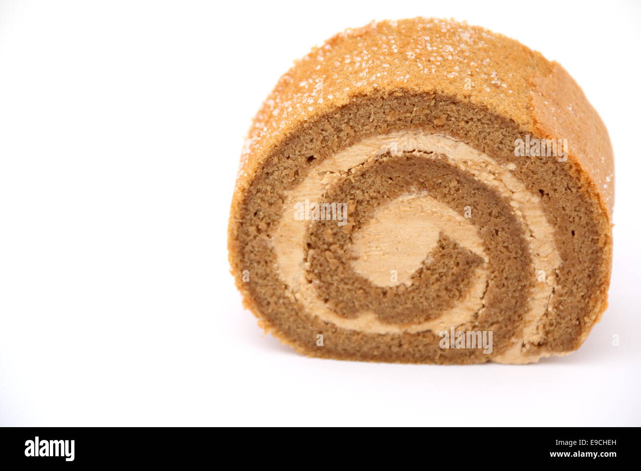 A coffee Swiss Roll Cake white background Stock Photo - Alamy