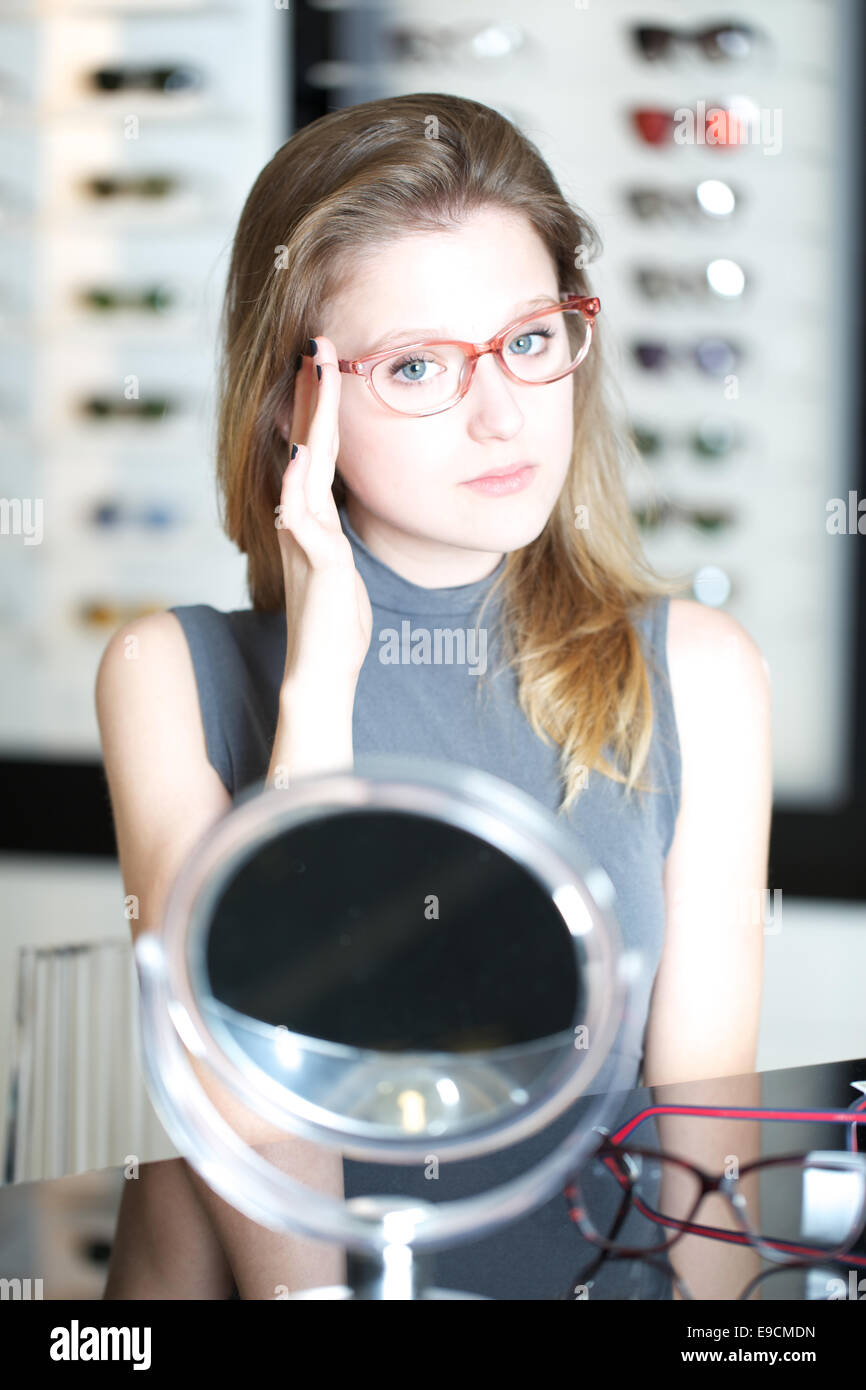 young beautiful model in a glasses store Stock Photo - Alamy