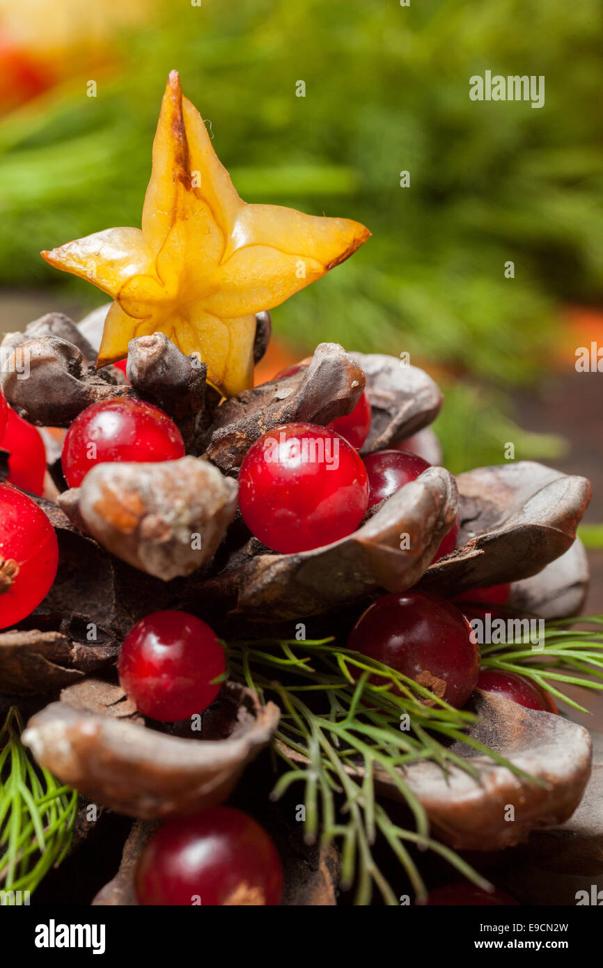Pine cone decorated cranberries tree hi-res stock photography and ...
