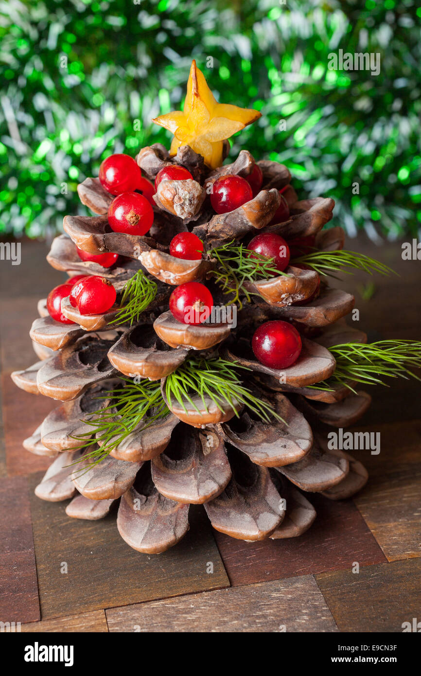 Pine cone decorated cranberries tree hi-res stock photography and ...