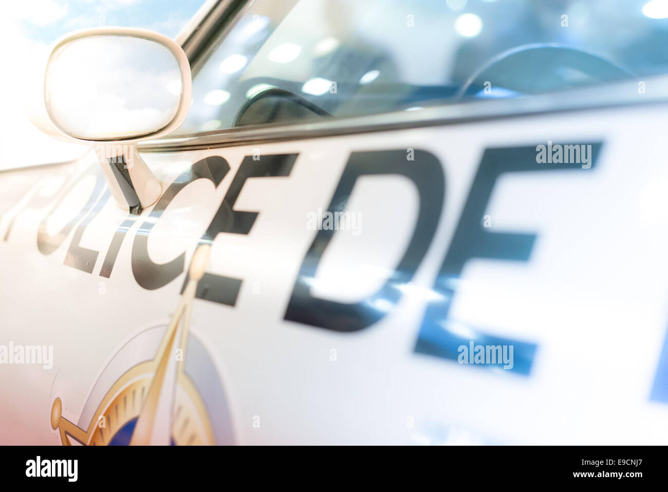 Close-up of the left driver's door, window and side mirror of police ...