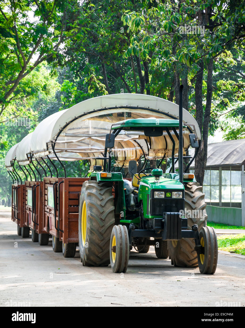 green tractor vehicle in farm Chokchai natural farm Stock Photo - Alamy