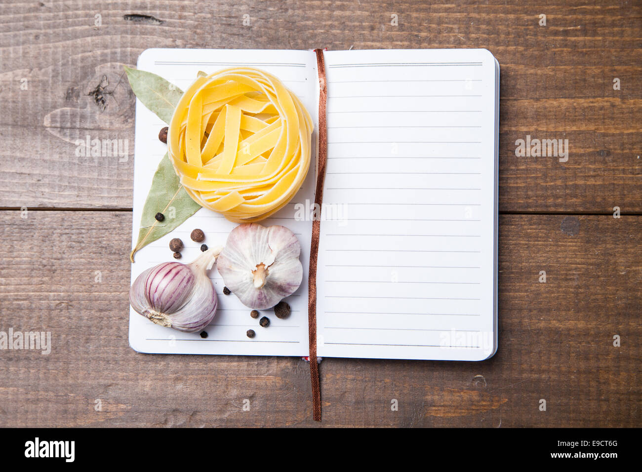 blank paper for recipes with ingredients, pasta, pepper and spices on ...