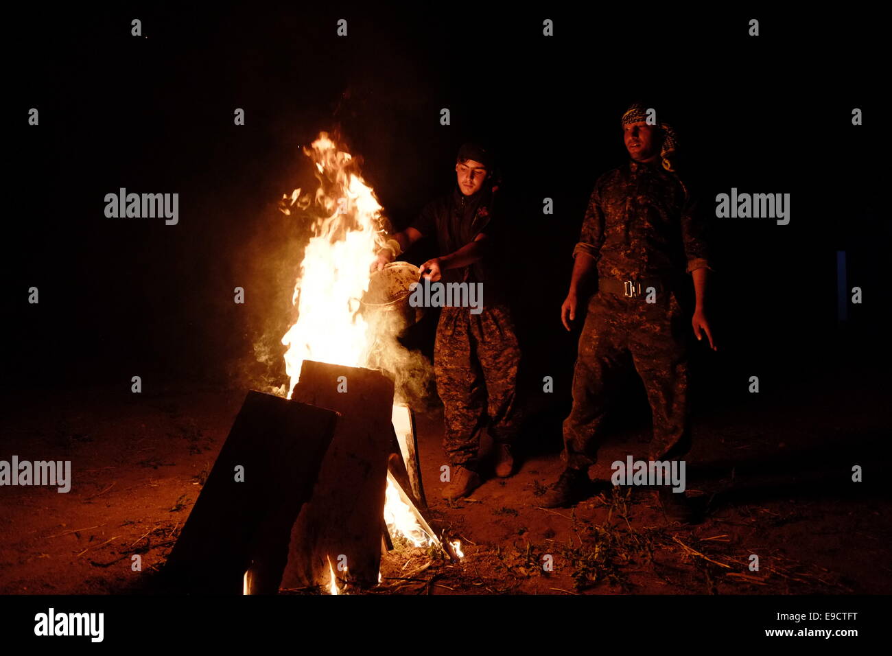 Fighters of the Kurdish People's Protection Unit YPG fighter setting up ...