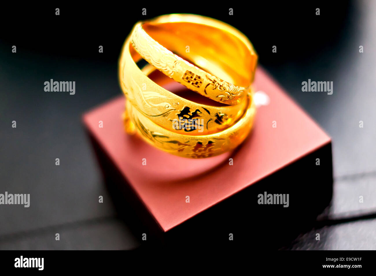 Traditional chinese gold bangles for wedding Stock Photo - Alamy