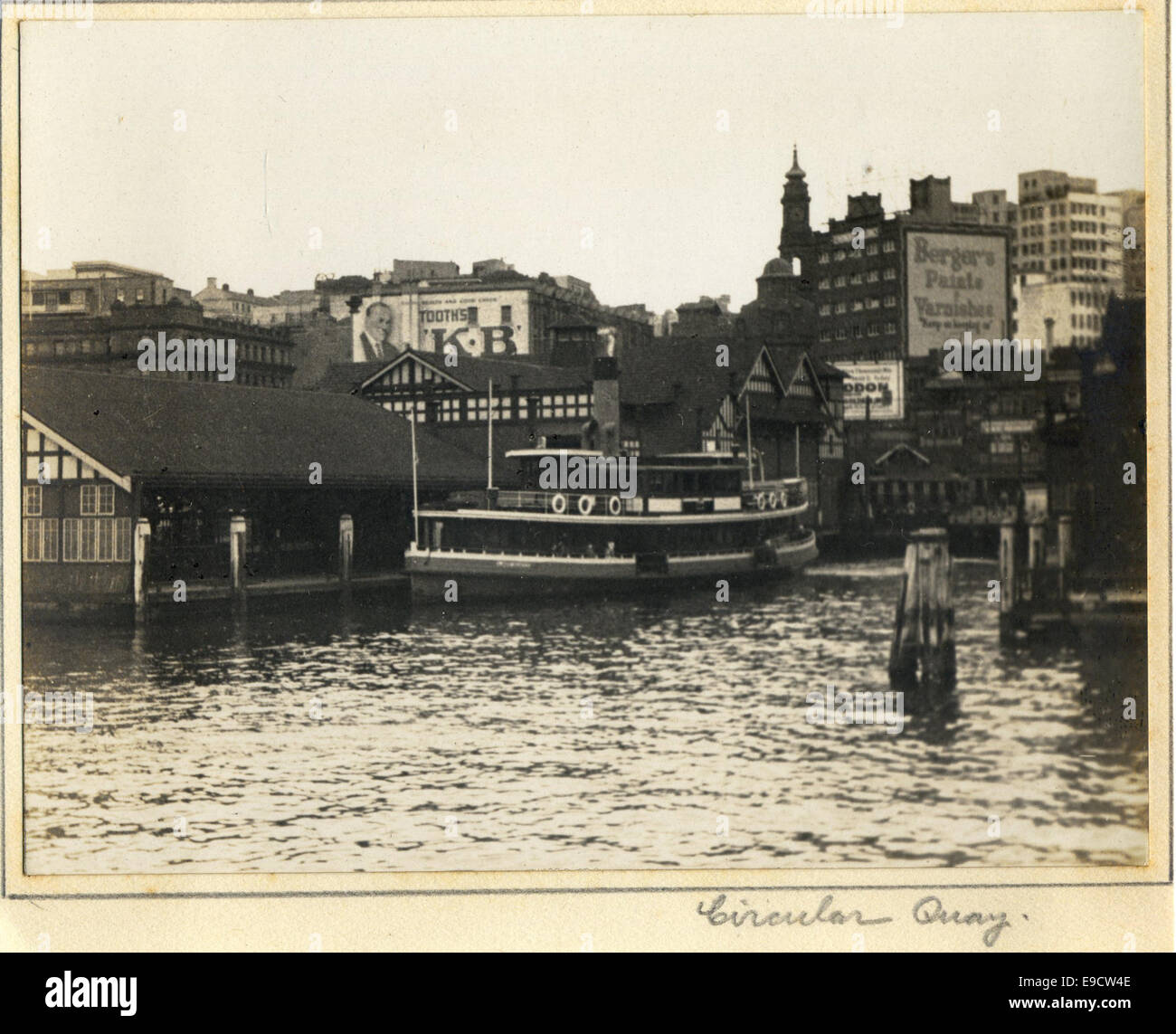 This photograph captures Circular Quay, a busy waterfront area in ...