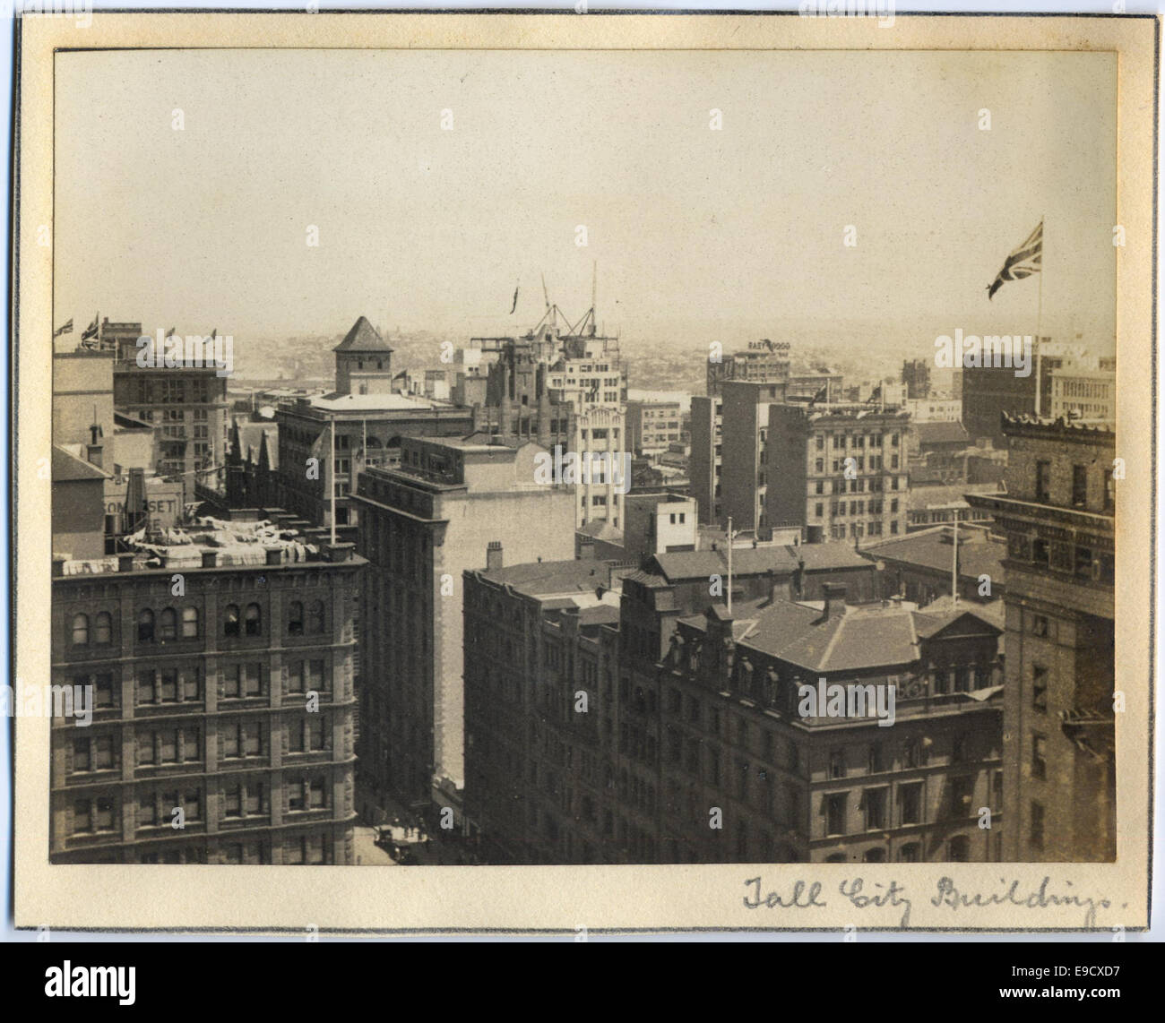 A photograph of tall city buildings, capturing the urban landscape of a ...