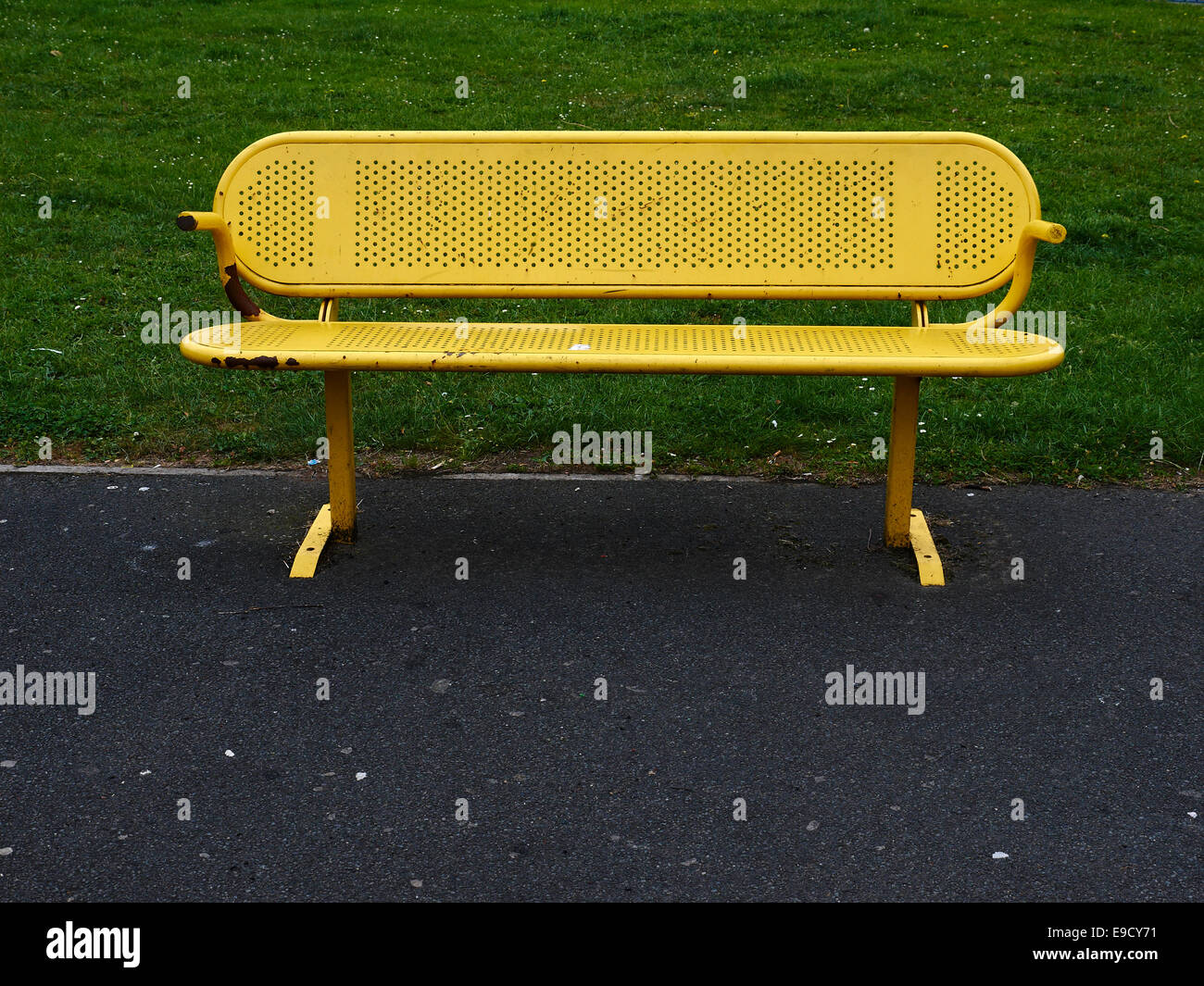 Empty yellow bench in park UK Stock Photo - Alamy