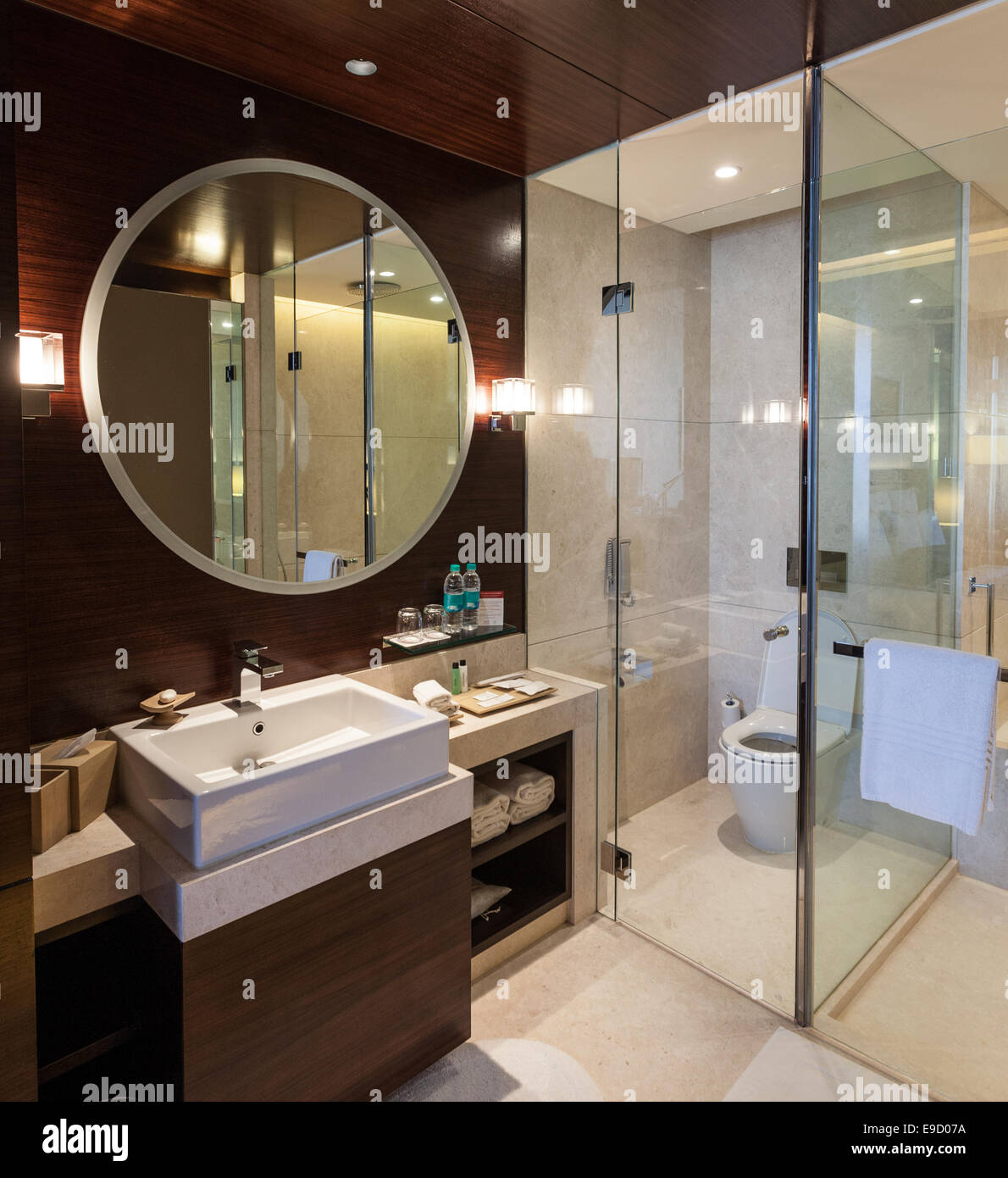 Luxury hotel bathroom with full length glass doors Stock Photo - Alamy