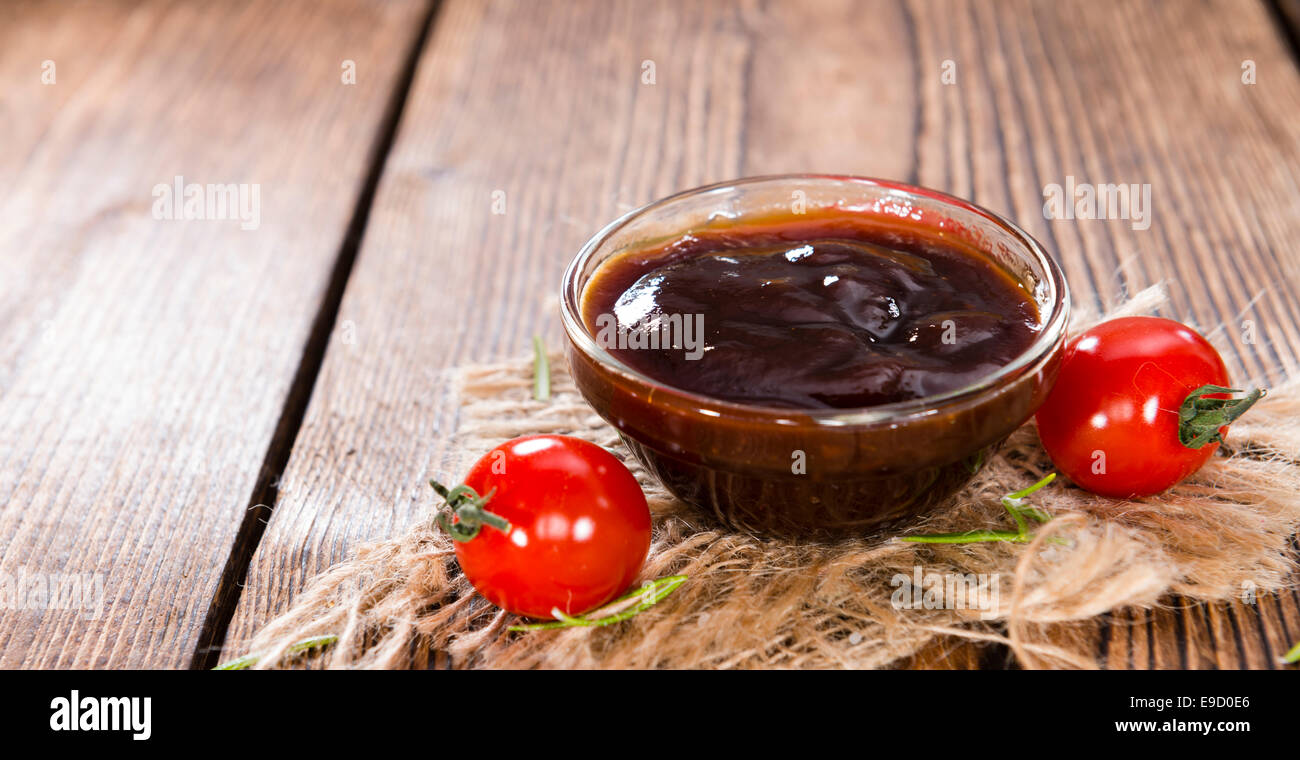 Portion of Barbeque Sauce (close-up shot) on dark rustic background ...