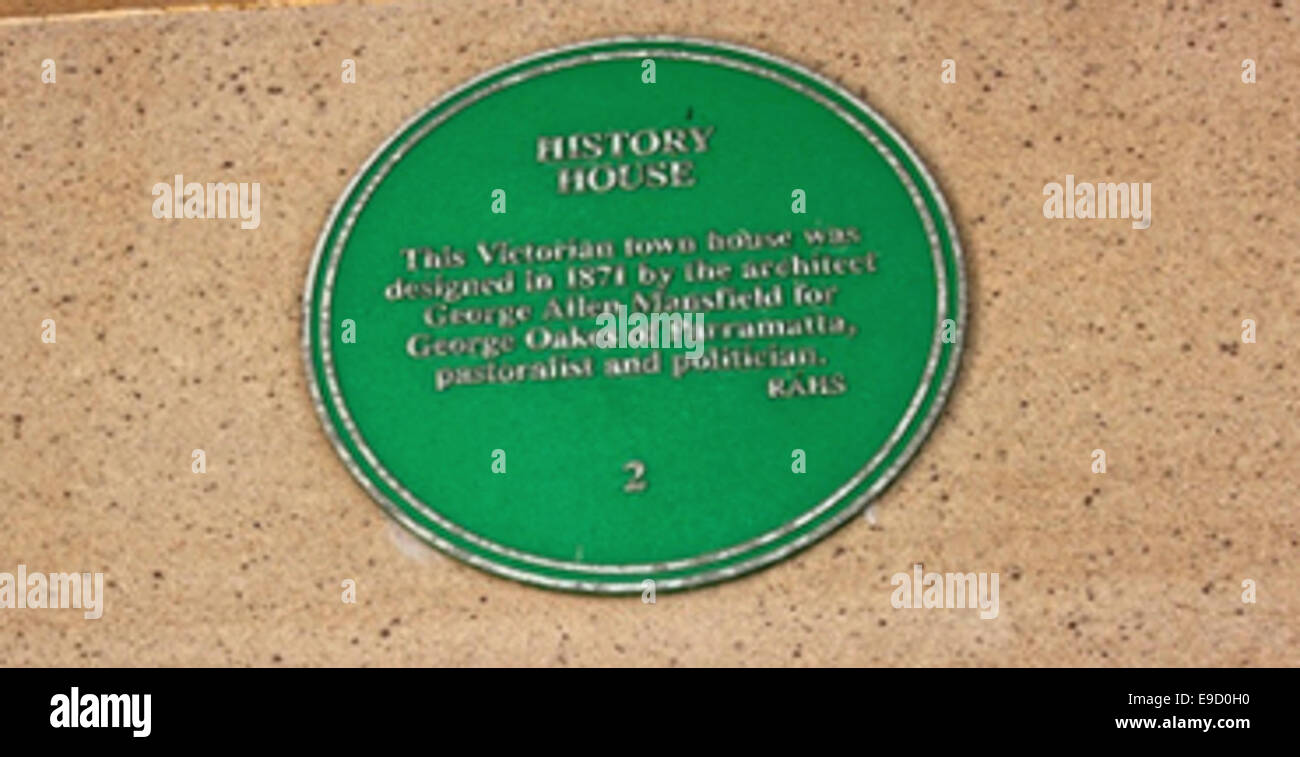 The photograph features the green plaque marking History House, a ...