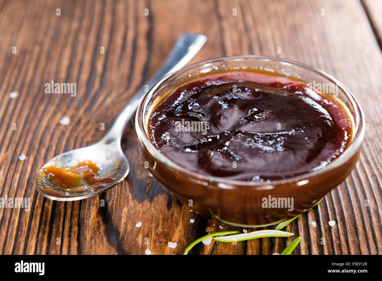 Barbeque Sauce with Tomatoes, Smoked Salt and fresh Herbs (on rustic ...