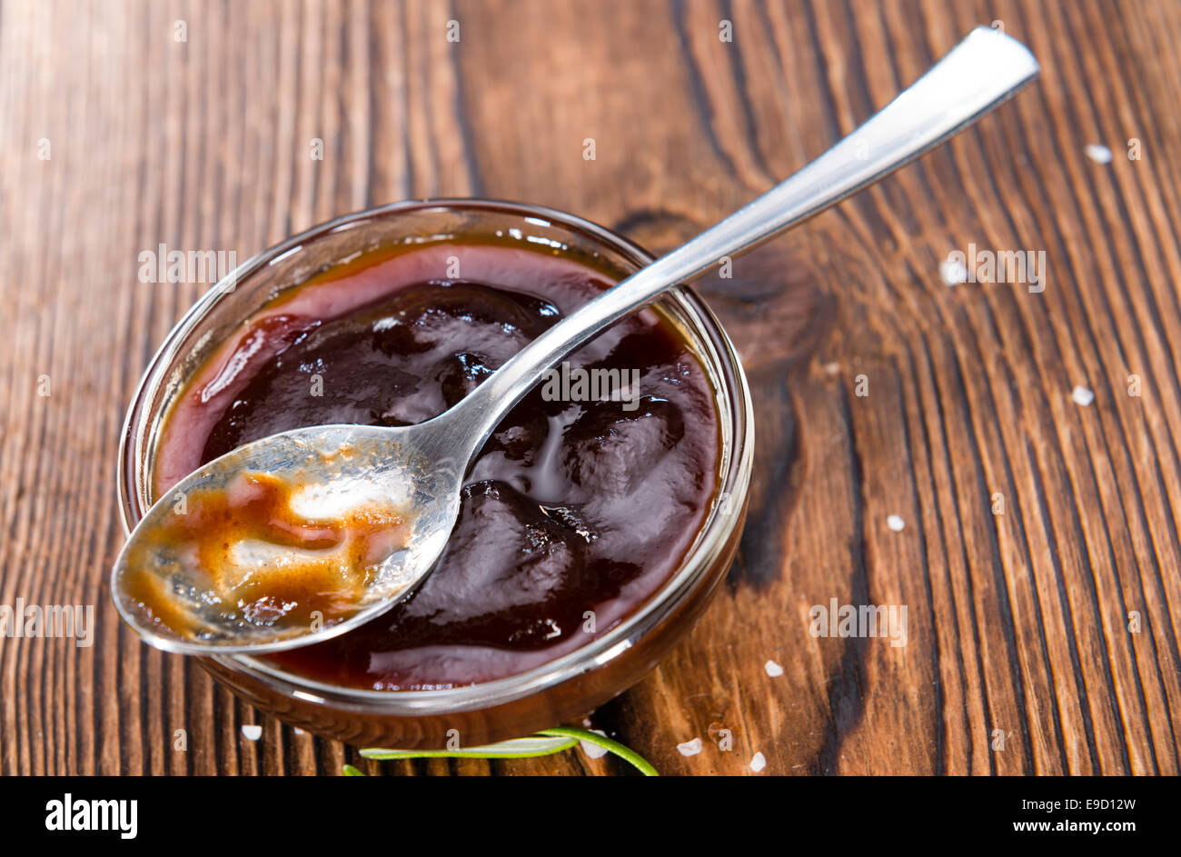 Portion of Barbeque Sauce (close-up shot) on dark rustic background ...