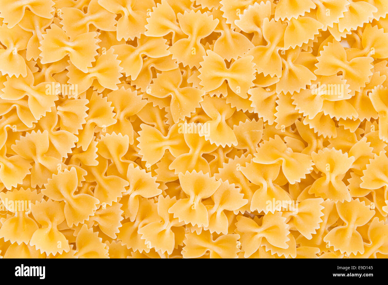 Raw Farfalle (also known as Bow-Tie Pasta) close-up shot for use as ...