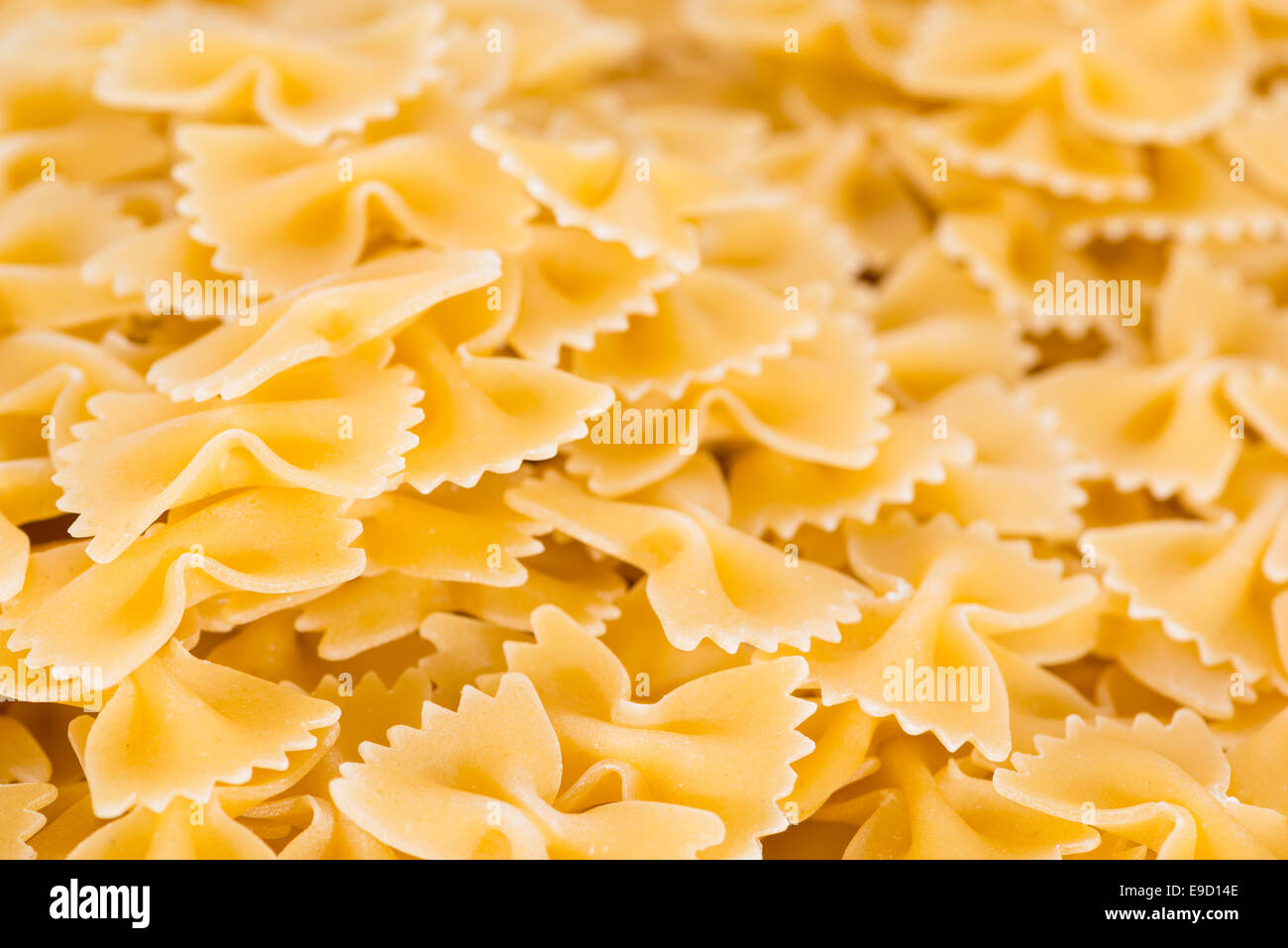 Raw Farfalle (also known as Bow-Tie Pasta) close-up shot for use as ...