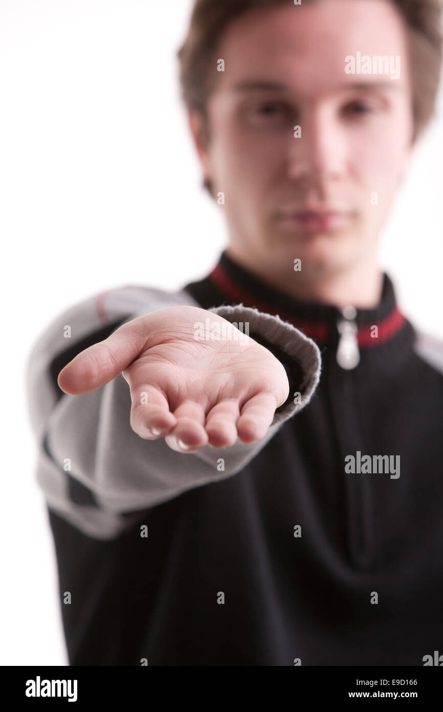 young man pushing out his hand to ask you what you owe him Stock Photo ...