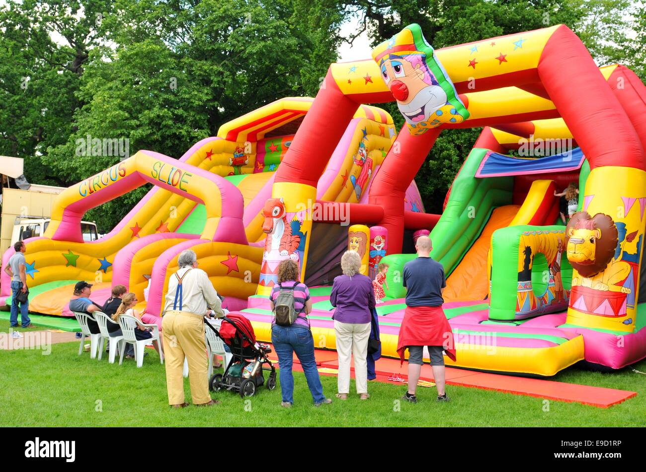 NOTTINGHAM, UK. JUNE 1, 2014: Children play in bouncing castle at ...
