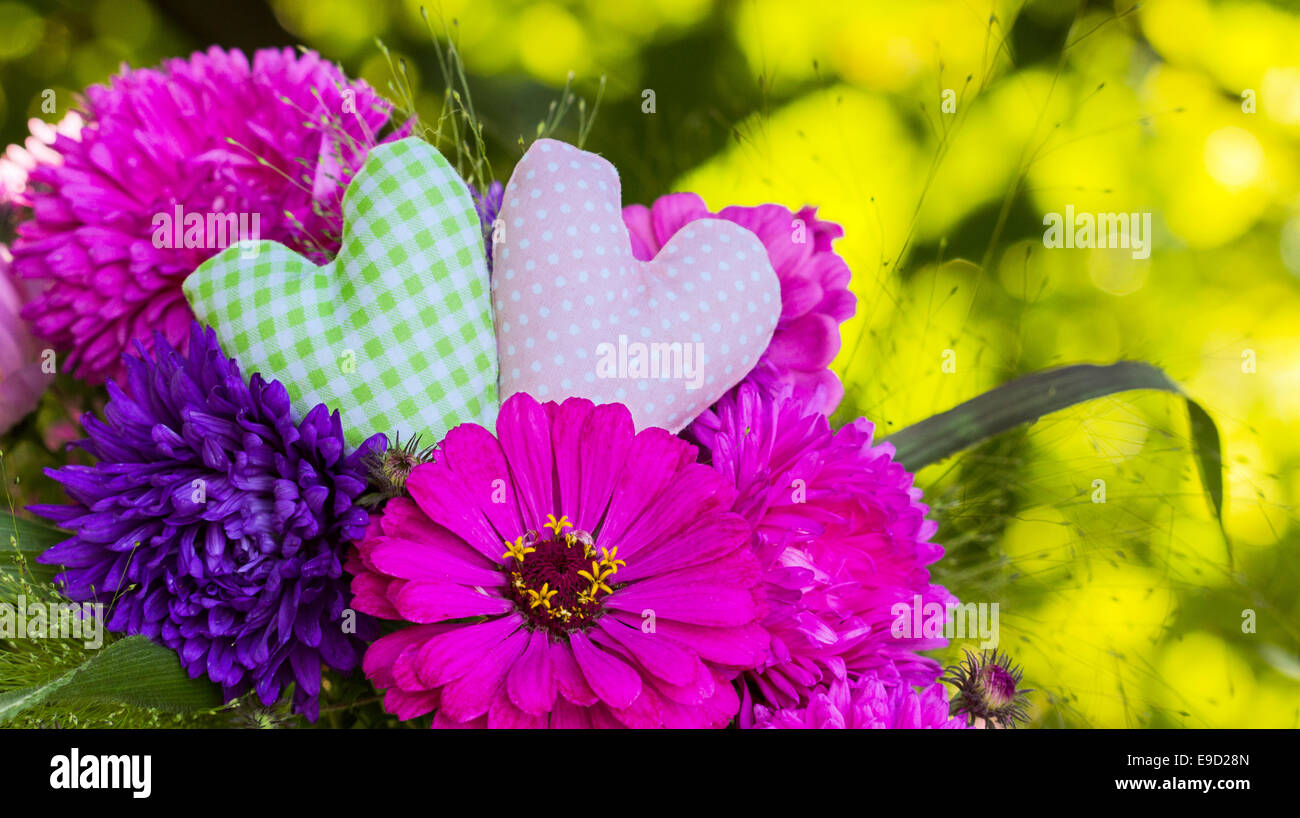 summer flowers with two hearts Stock Photo - Alamy