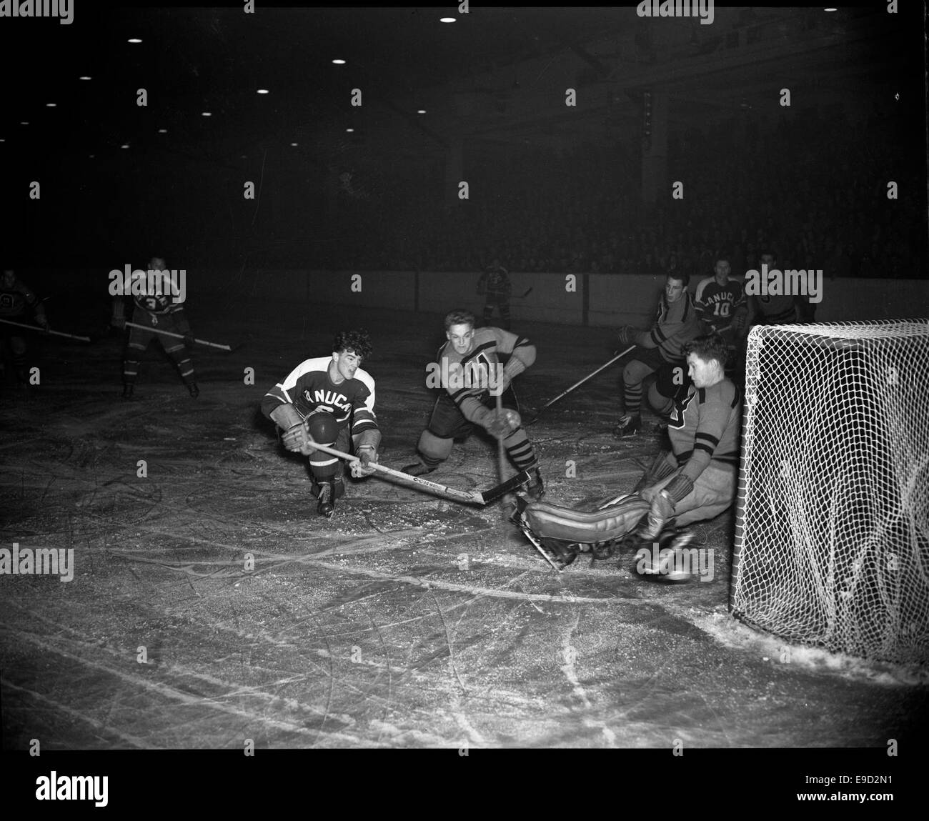 Photograph from a Vancouver Canucks hockey game, capturing players on ...