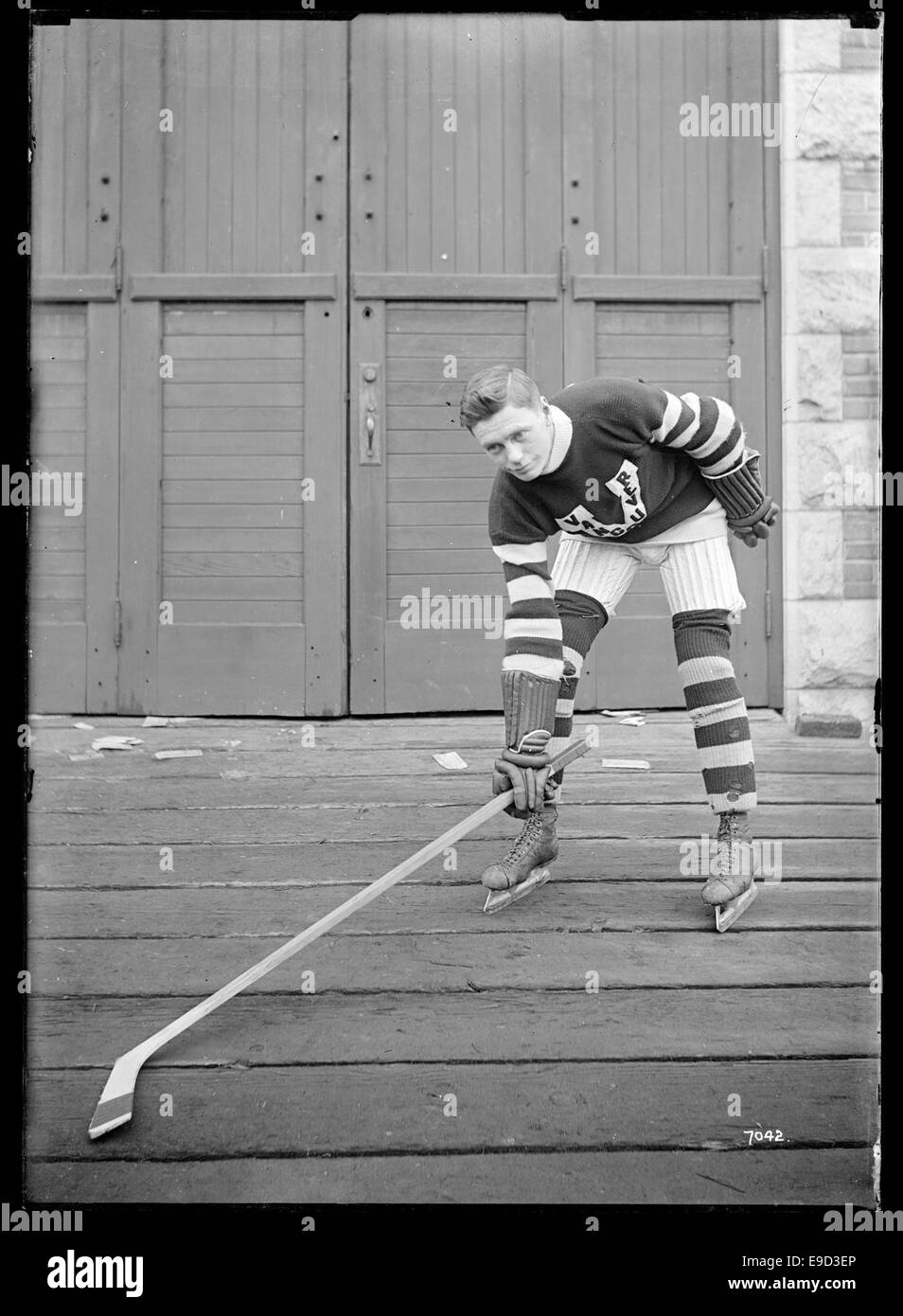 This image shows Lloyd Cook, a Vancouver hockey player, showcasing a ...