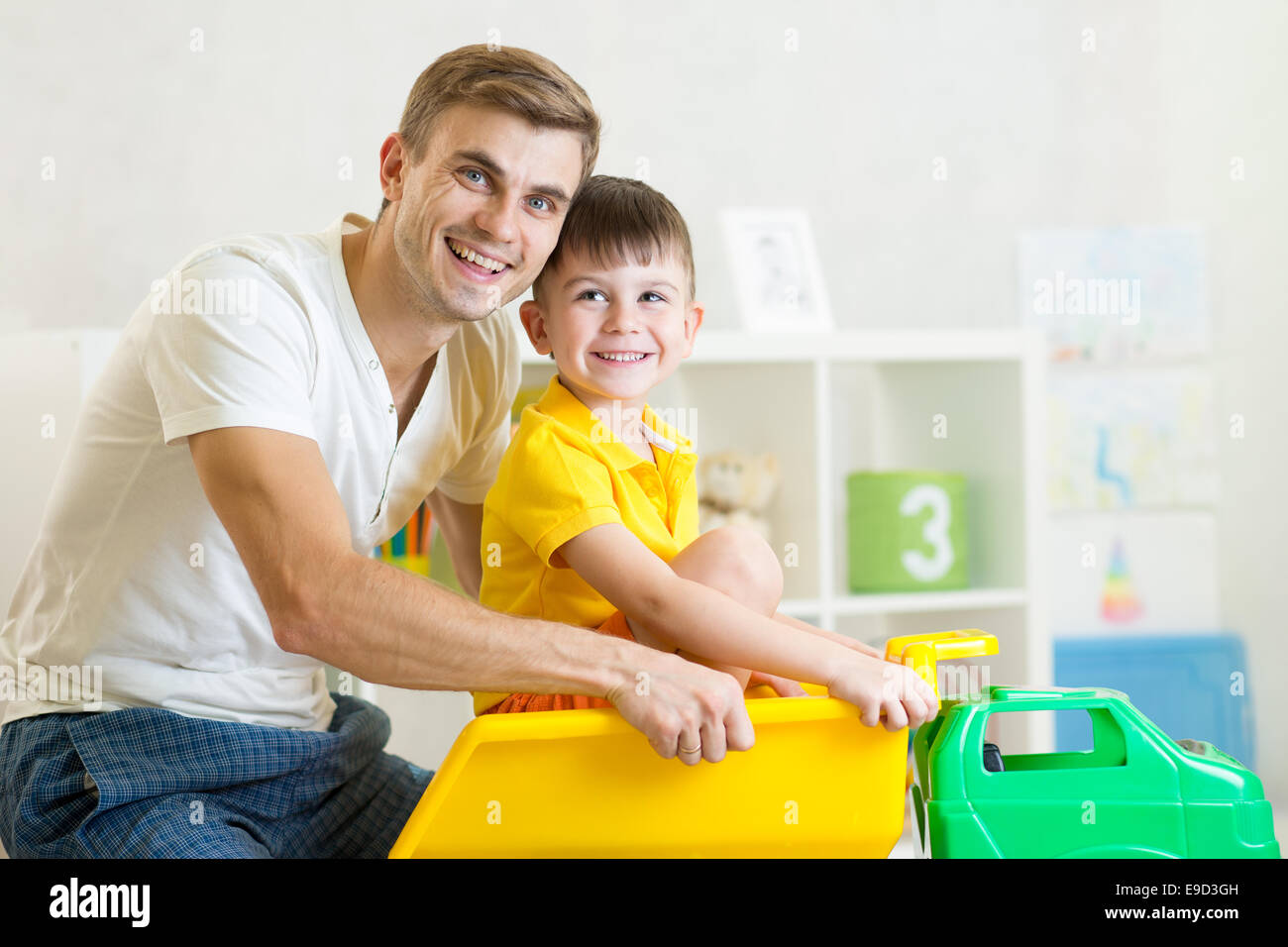 kid boy and his dad play with toy trunk Stock Photo - Alamy