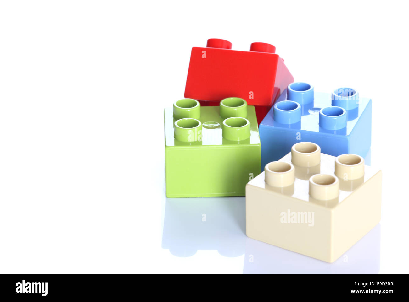 Plastic toy blocks on white background Stock Photo - Alamy