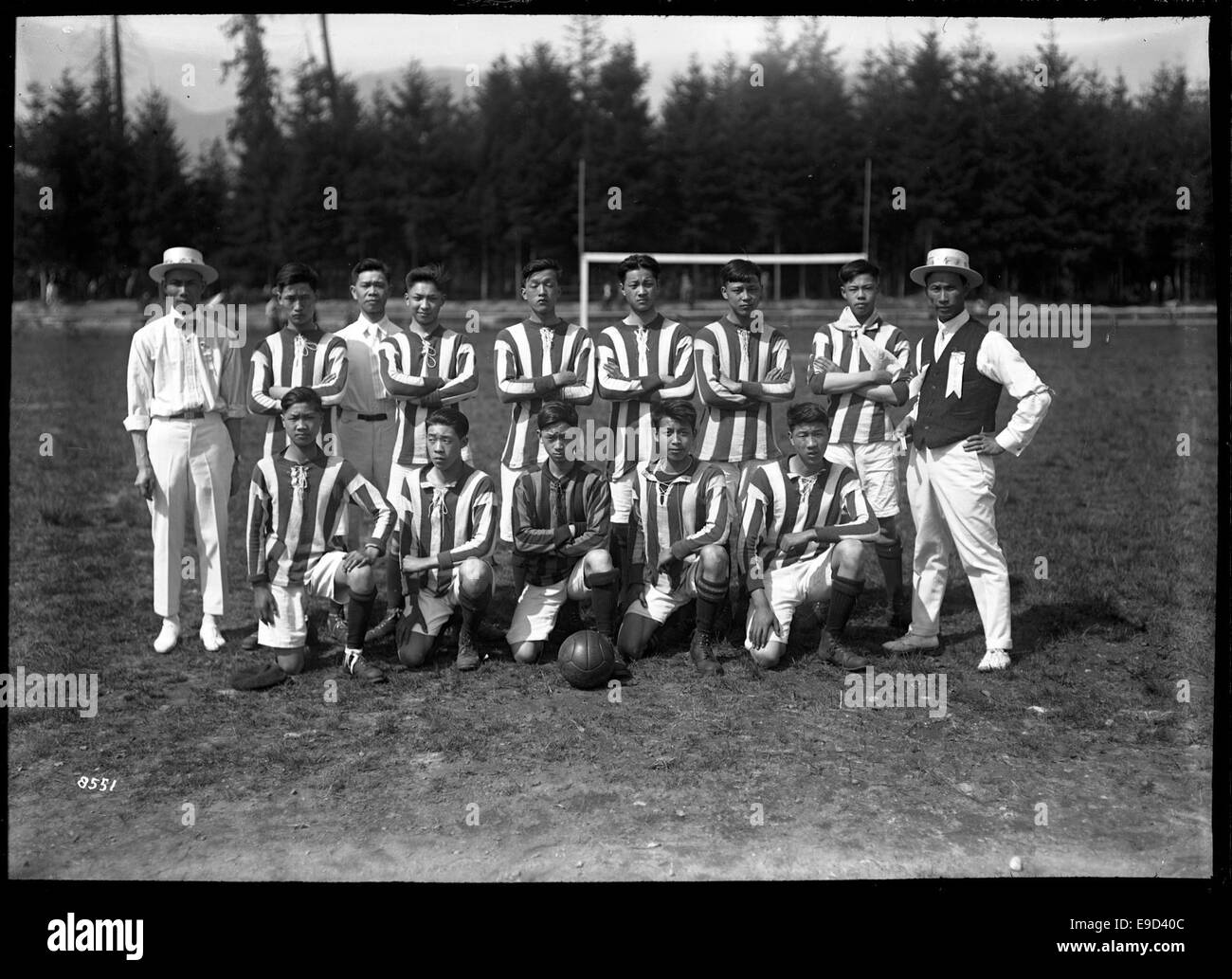 A photograph of a soccer-rugby team at a Chinese Convention. The image ...