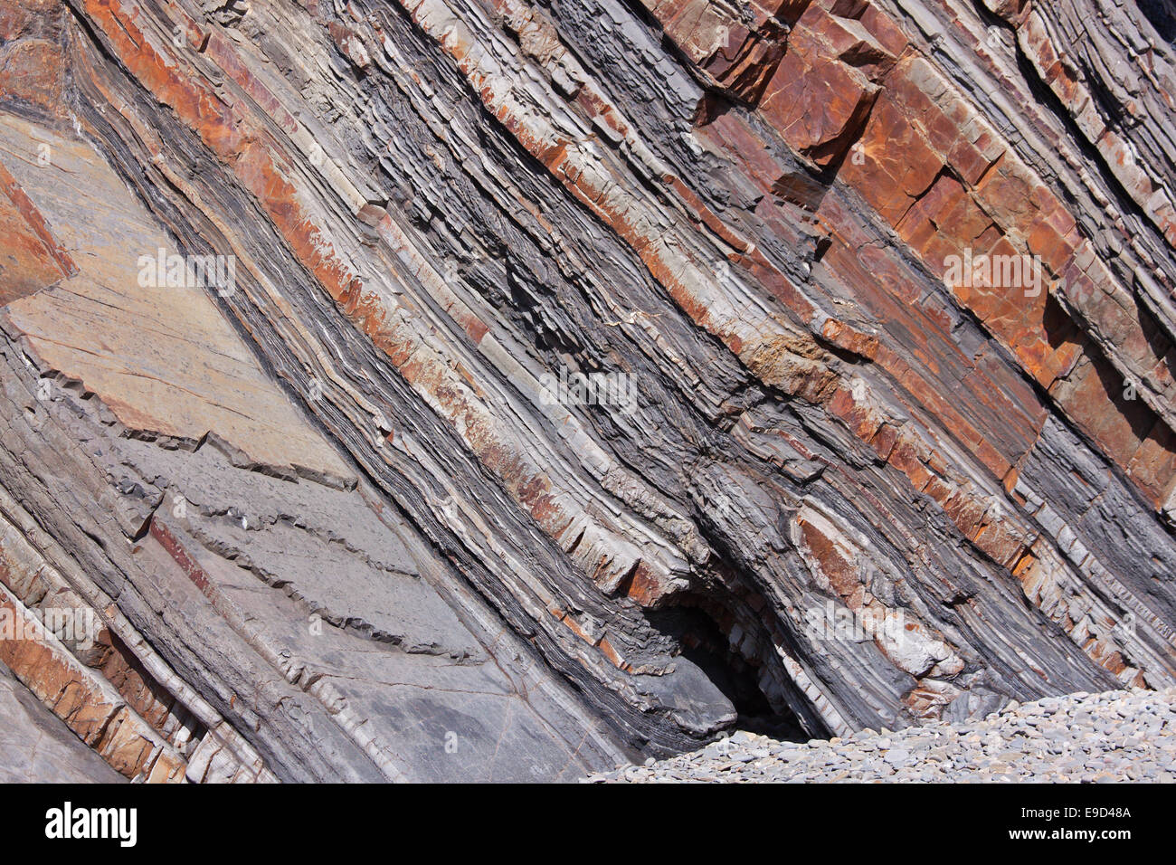 Cliff face housing a small cave located on the North Cornish coast ...