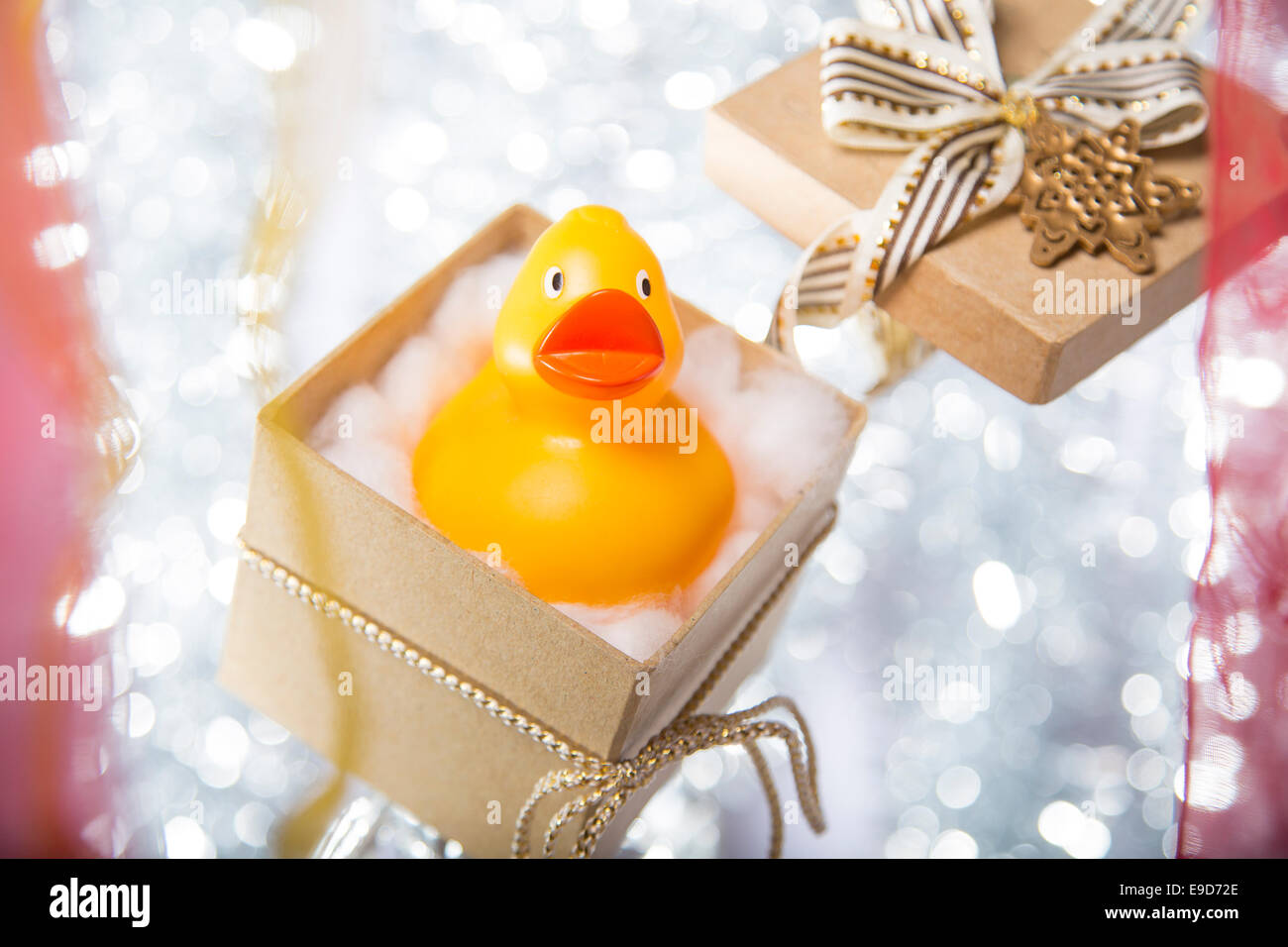 open christmas gift box with rubber duck, ribbon and bow Stock Photo ...