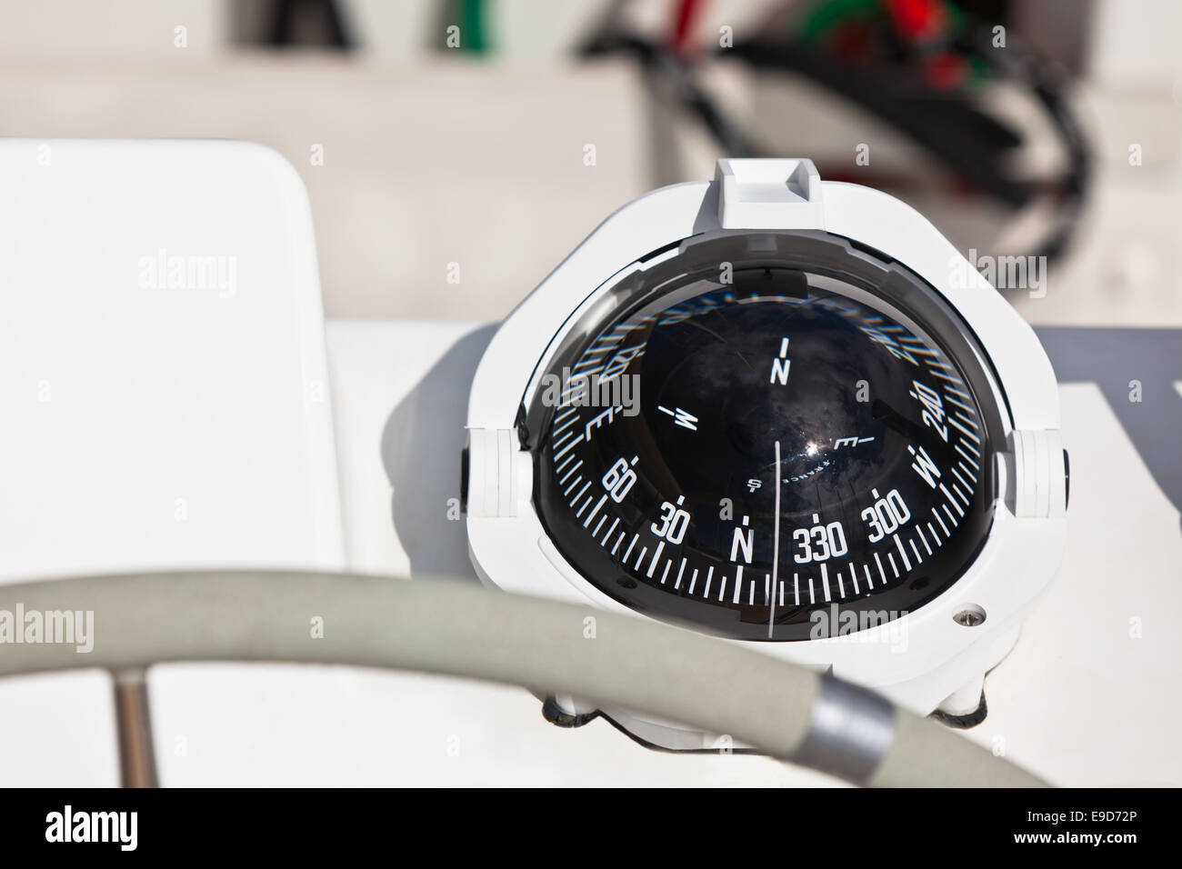 Sailing yacht compass and control wheel. Horizontal close up shot Stock ...