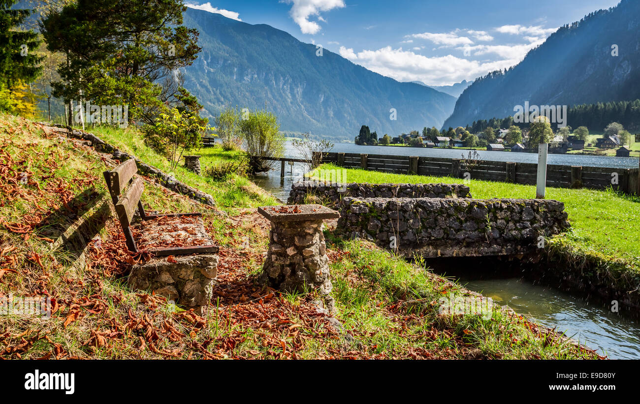 Stone bench at the mountain river Stock Photo - Alamy