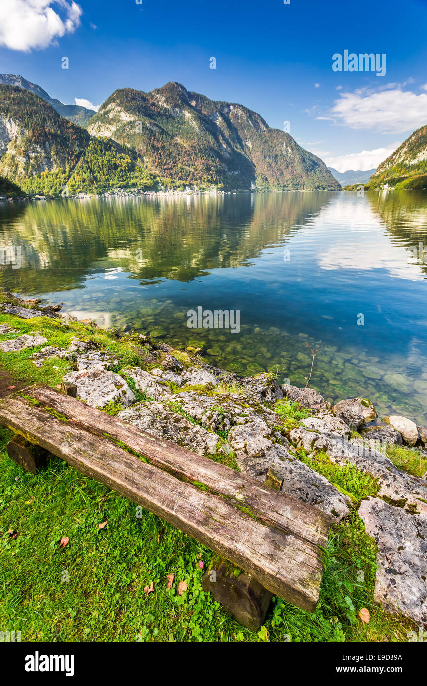 Old bench at mountain lake in the Alps Stock Photo - Alamy