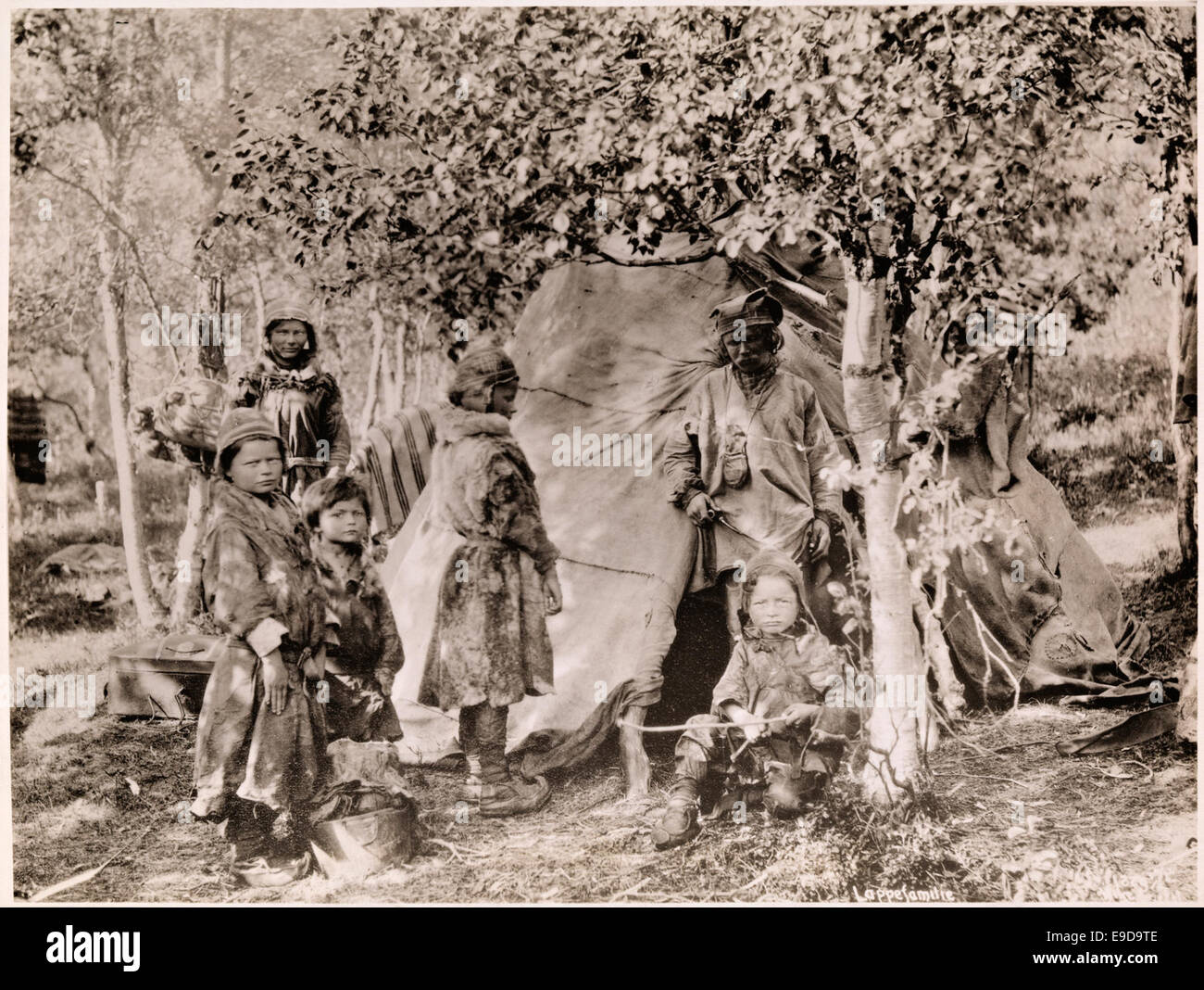 This photograph by Anders Beer Wilse shows a Sami family, including ...