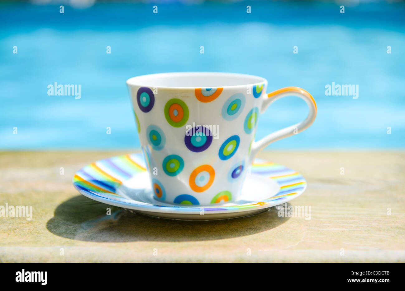 Colorful cup of coffee on the pool Stock Photo - Alamy