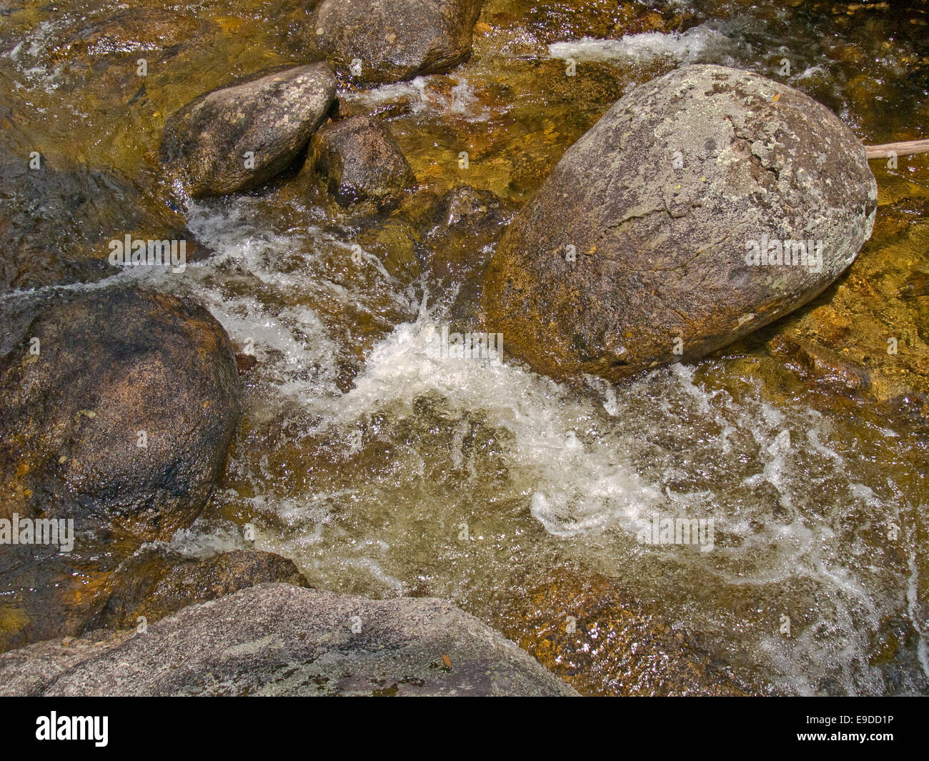 Stream flowing boulders hi-res stock photography and images - Alamy