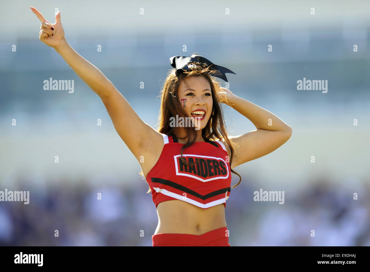 A Texas Tech cheerleader performs during an NCAA football game when the ...