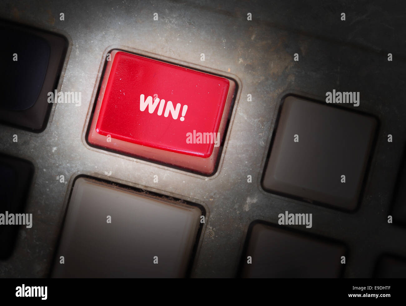 Red button on a dirty old panel, selective focus - win Stock Photo - Alamy